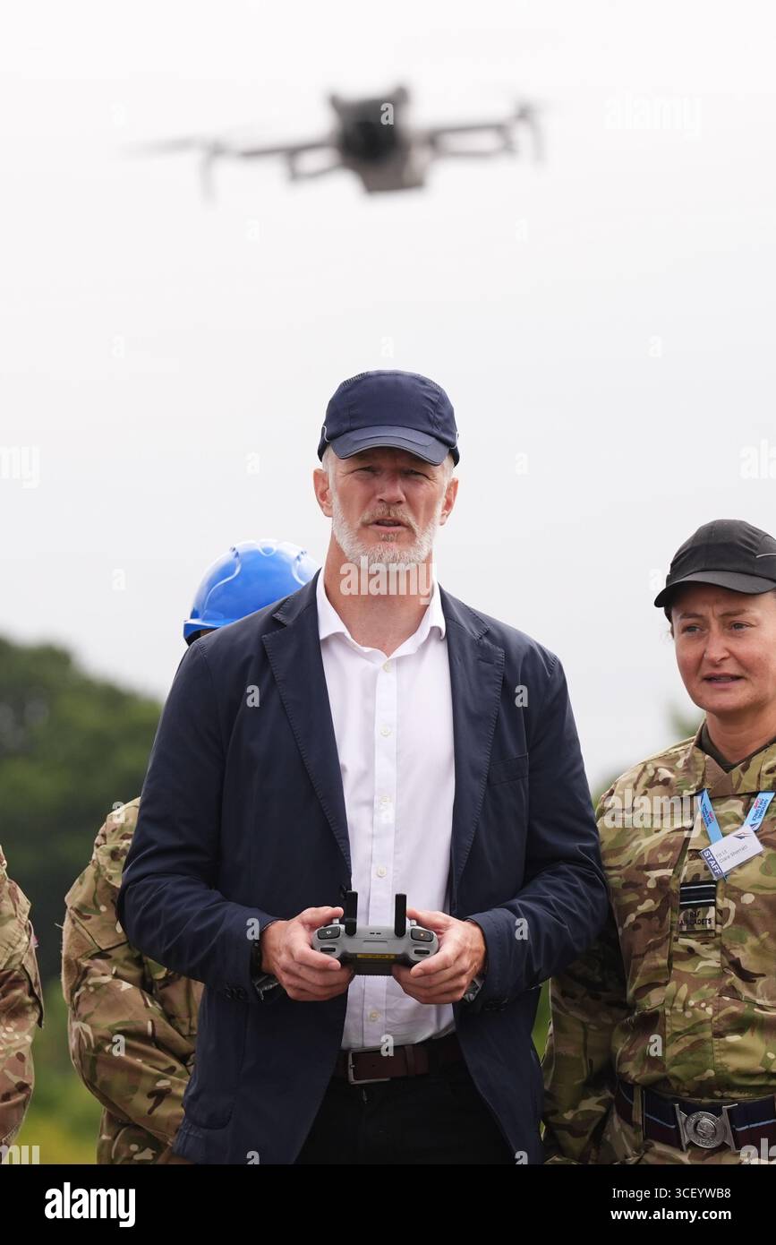 Minister for Veterans and People, Al Carns operates a drone as he ...