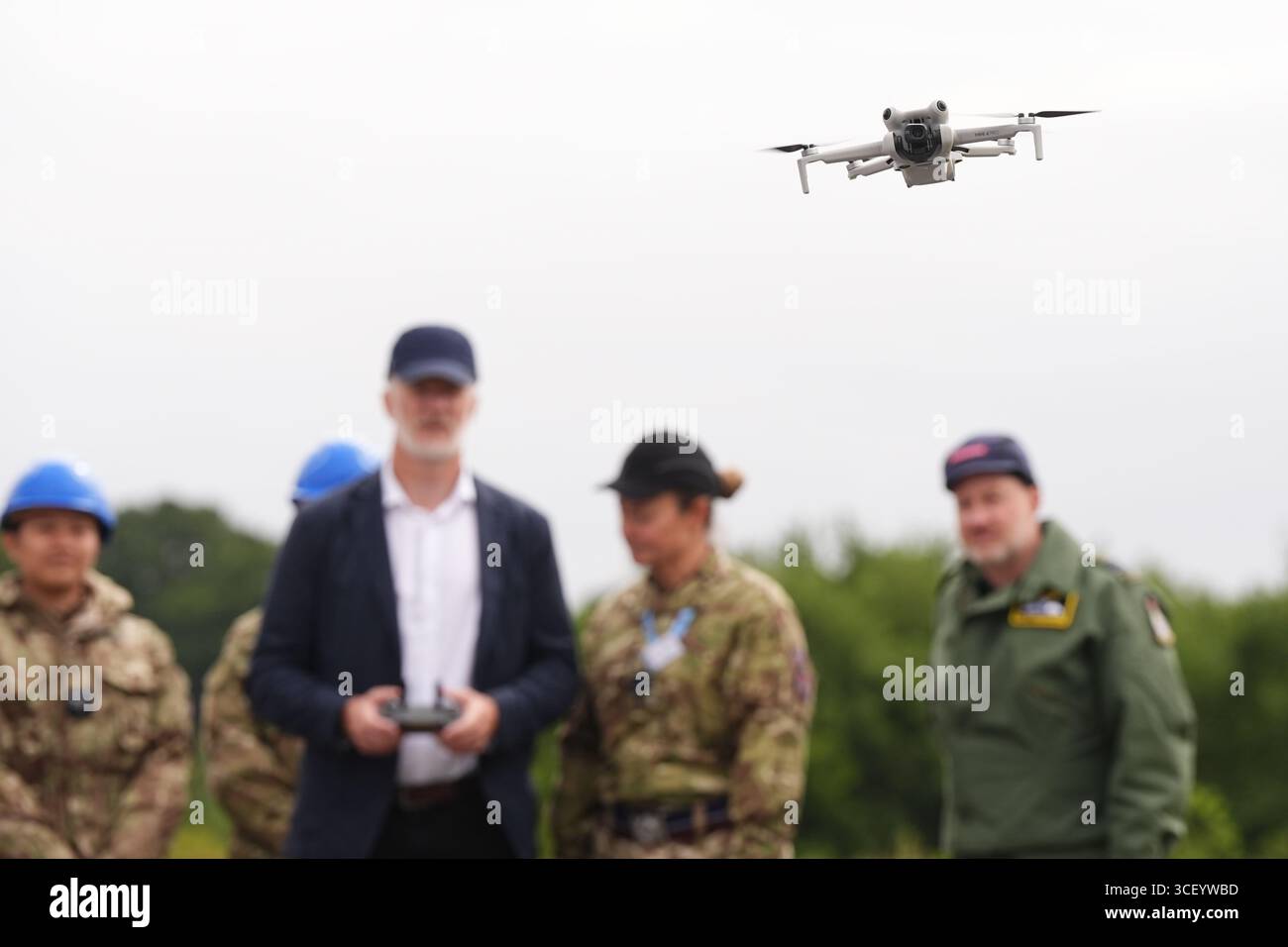 Minister for Veterans and People, Al Carns operates a drone as he ...