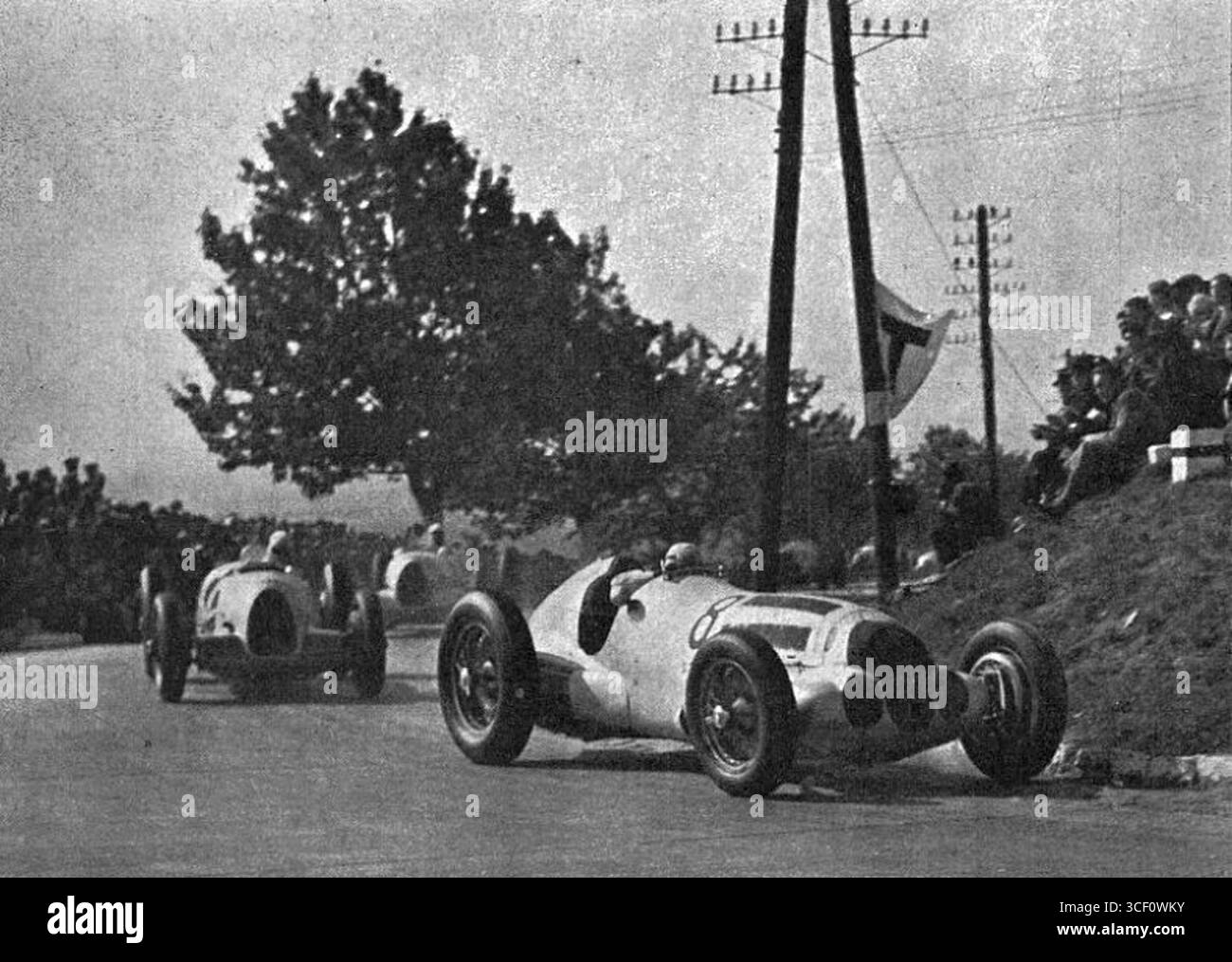 Hermann Lang driving a Mercedes-Benz W 125 at the Masaryk Circuit in ...
