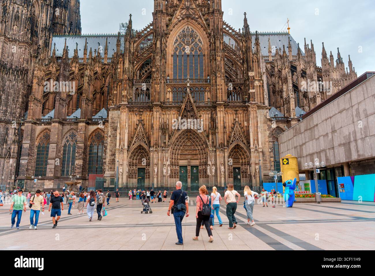 Cologne, Germany - June 15, 2025: Crowd of tourists walking toward the ...
