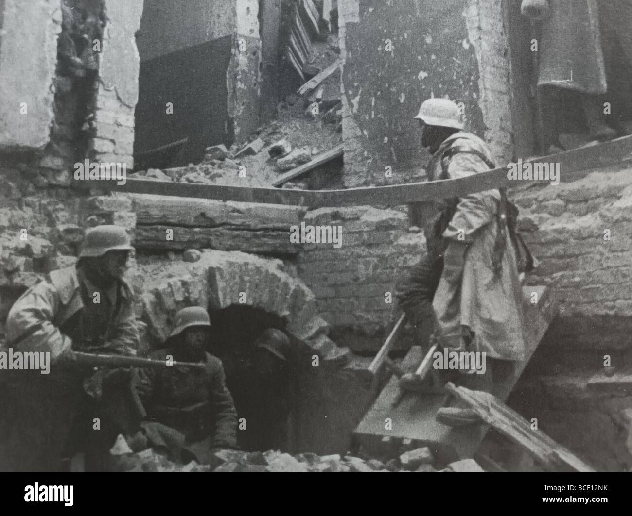 This winter 1942-43 photograph shows German soldiers in combat amidst ...