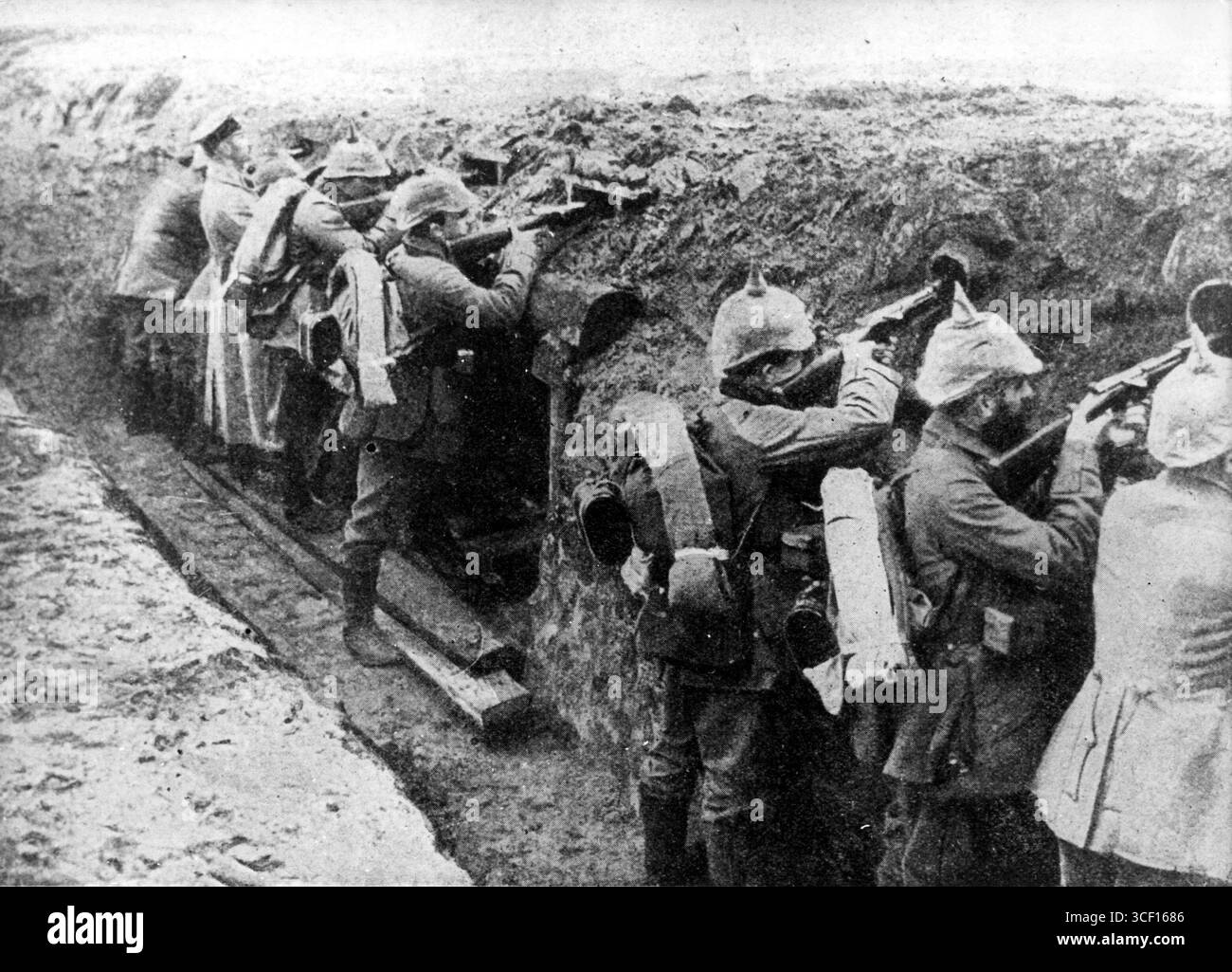 In 1914, German soldiers are shown in a newly constructed trench with ...