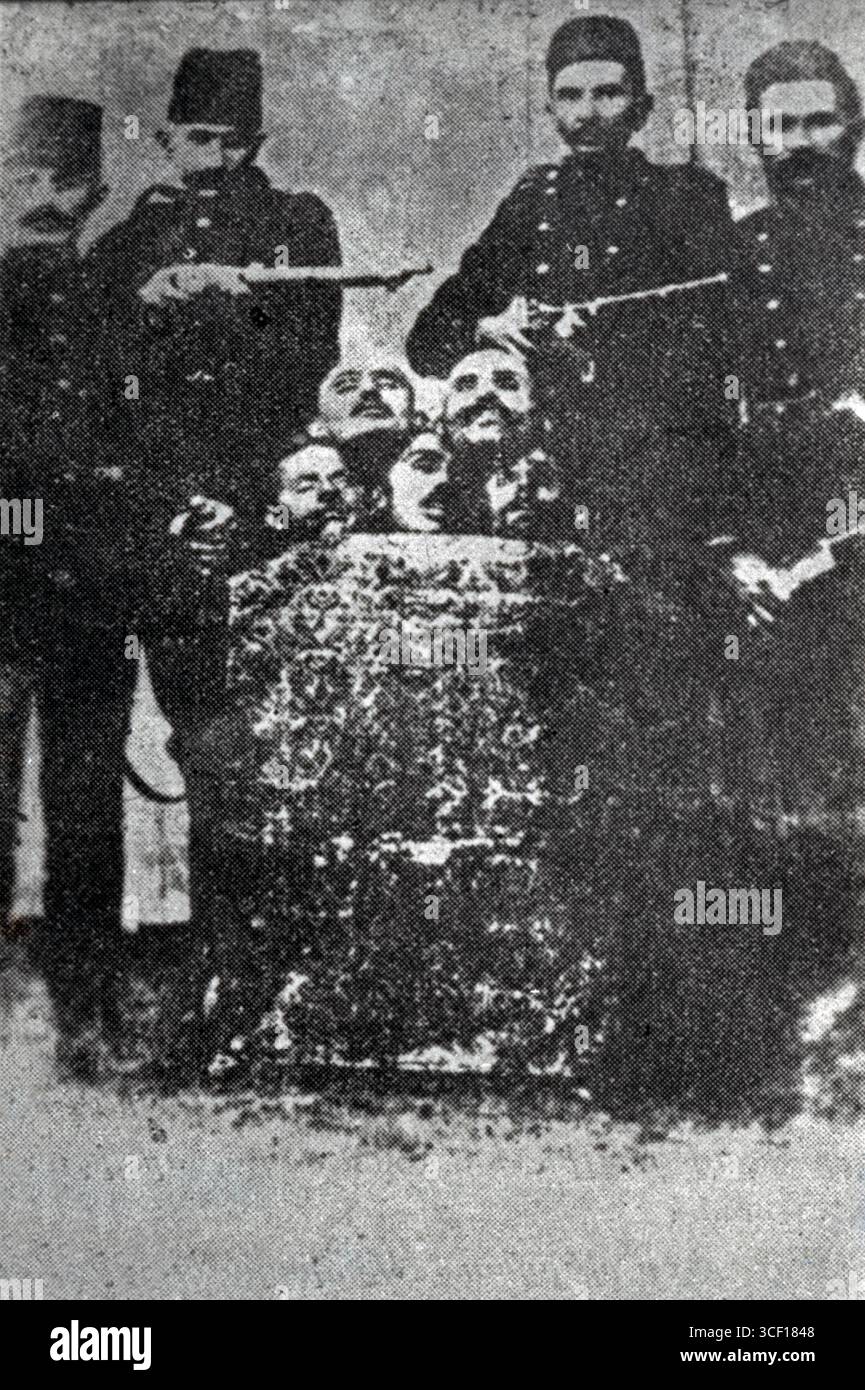 Between 1914 and 1918, Turkish soldiers stand behind the decapitated ...