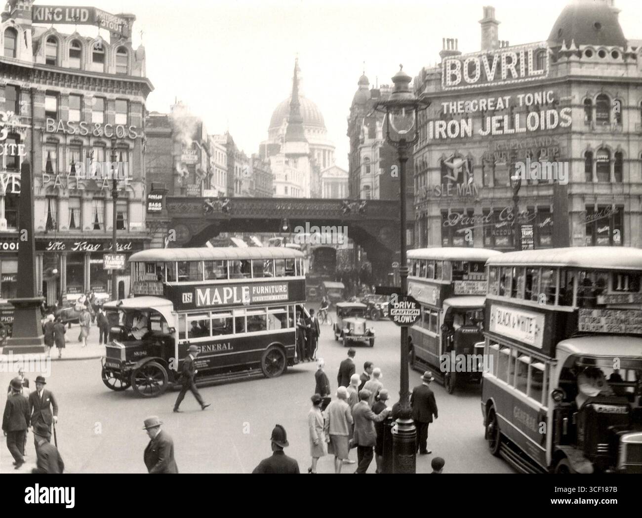 Double-decker buses in The City of London, seen from Fleet Street ...