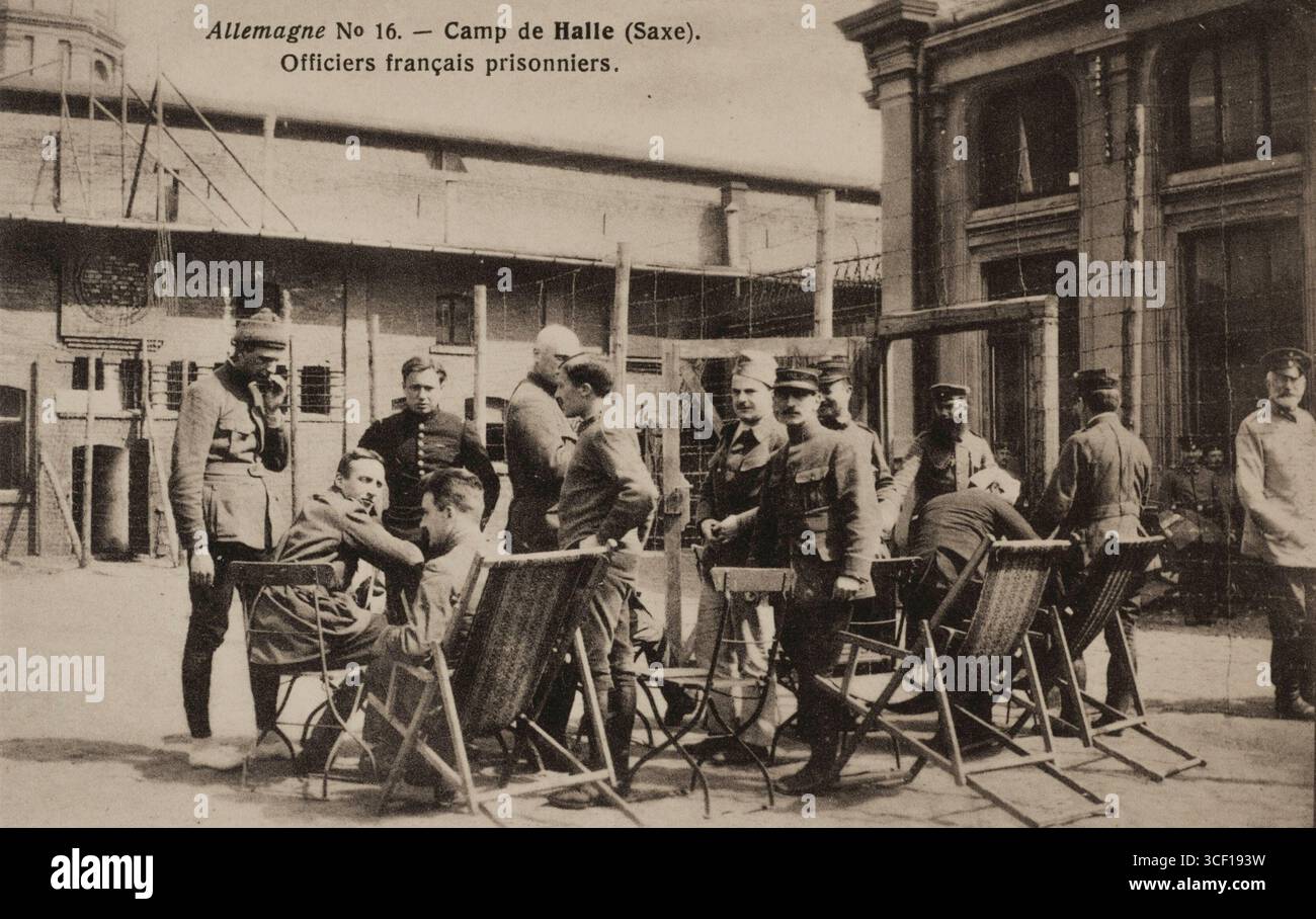 French officers and prisoners are shown together in a courtyard at Camp ...