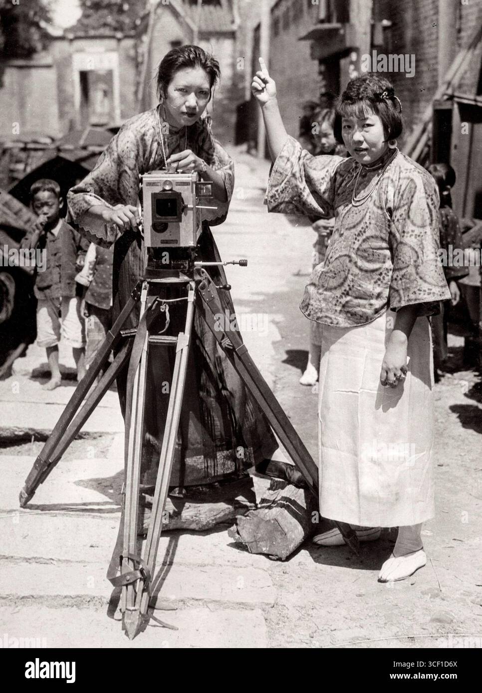 A female director and a camerawoman working on the first Chinese film ...