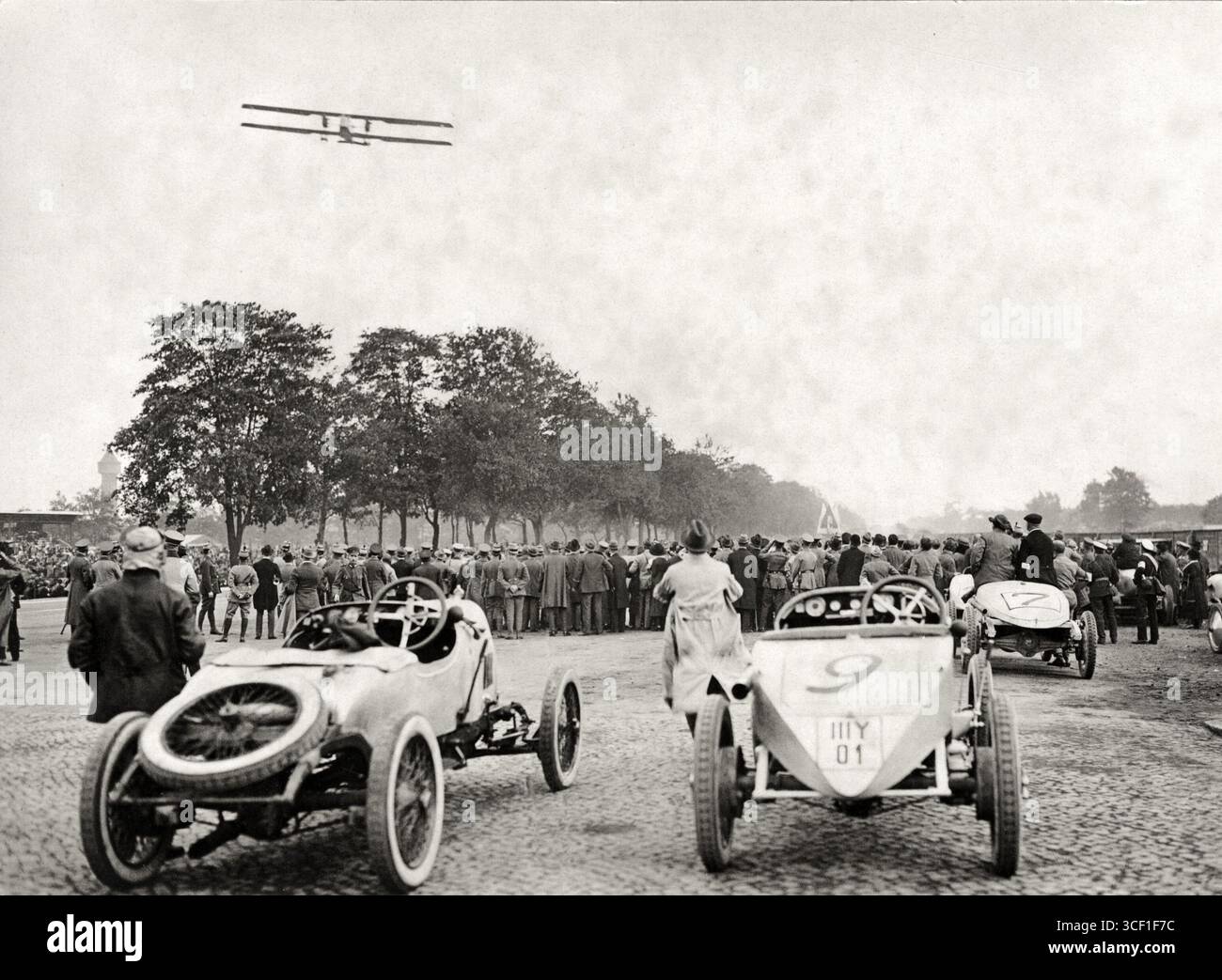 In the first car race at Berlin's Grunewald track in 1921, a plane ...