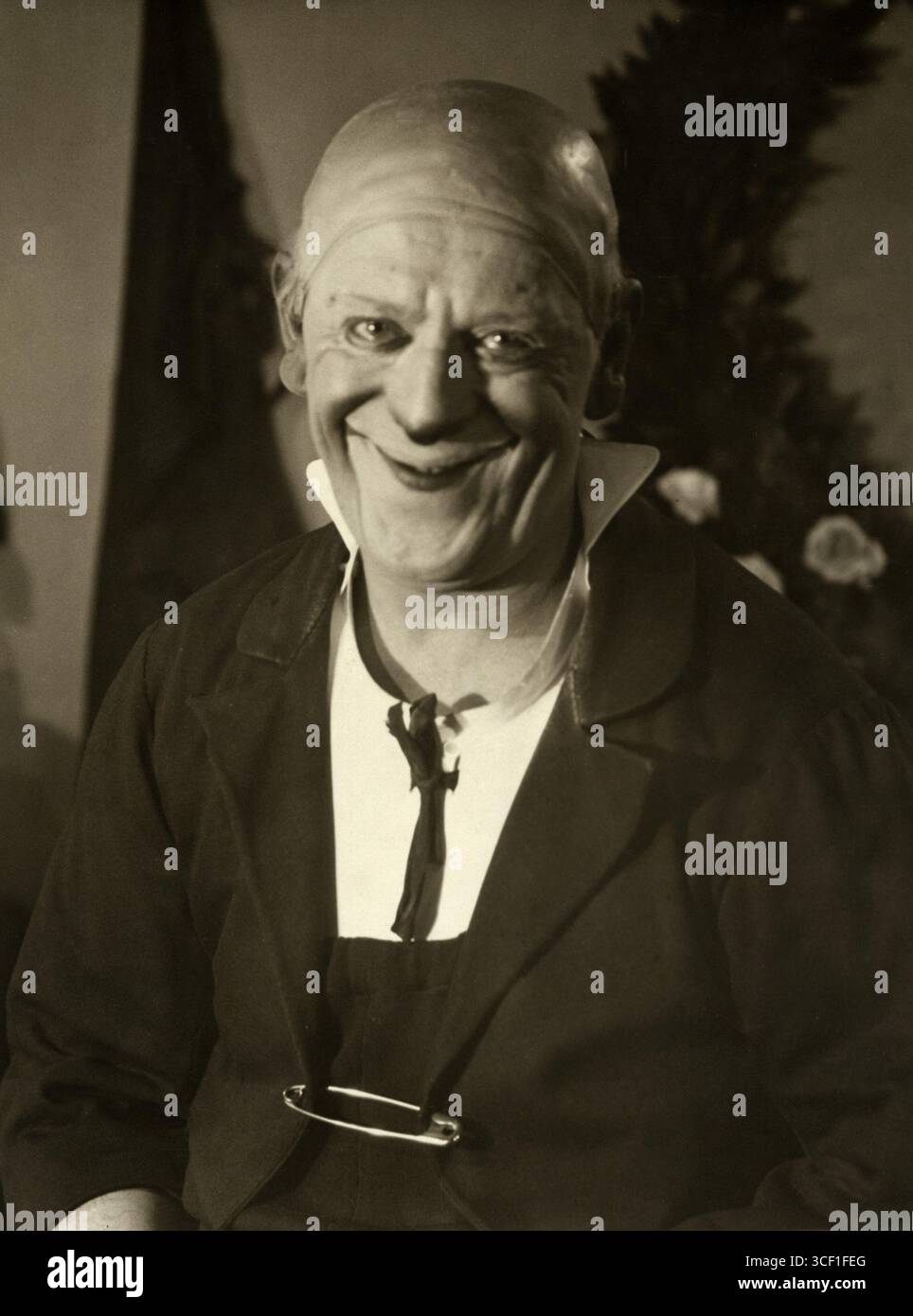A portrait of clown Grock (Adrien Wettach), after completing his makeup ...