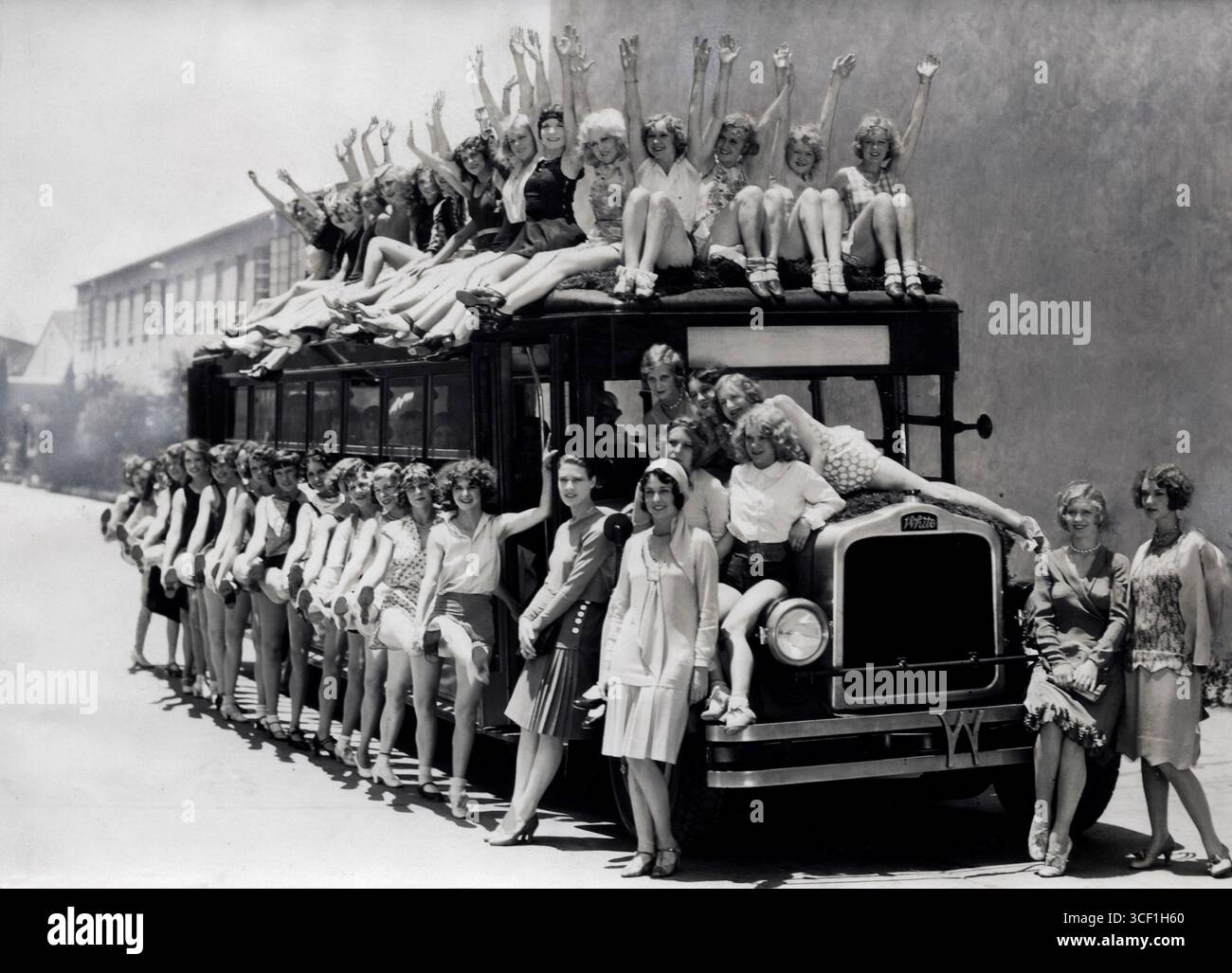 A busload of chorus-line girls from Warner Brothers film studio, posing ...