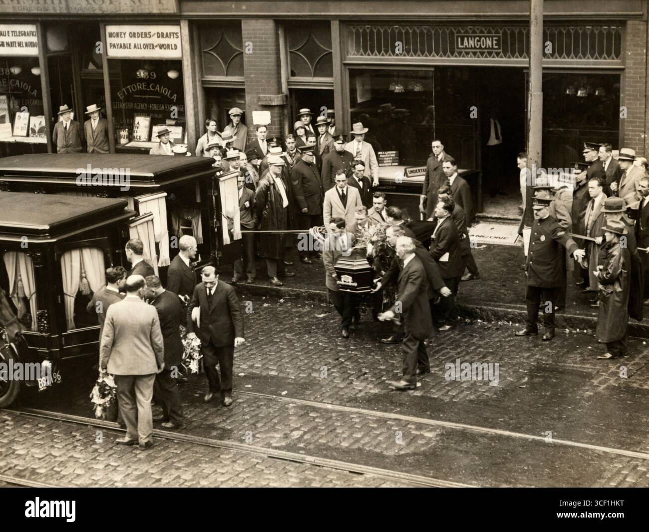 The coffins of Sacco and Vanzetti are carried out of the funeral home ...