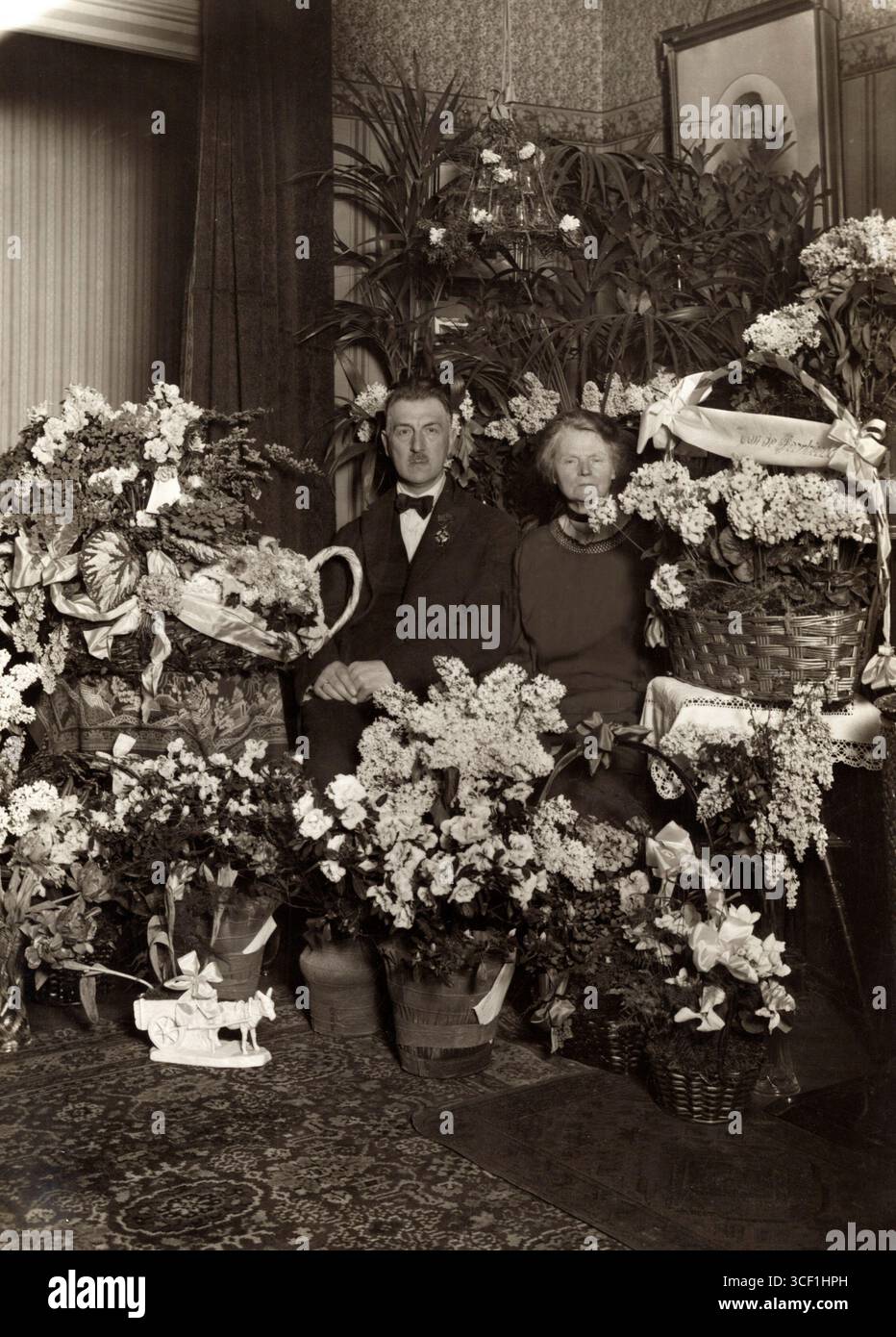 Jacob Vincent (1868-1953) and his wife sitting among baskets of ...