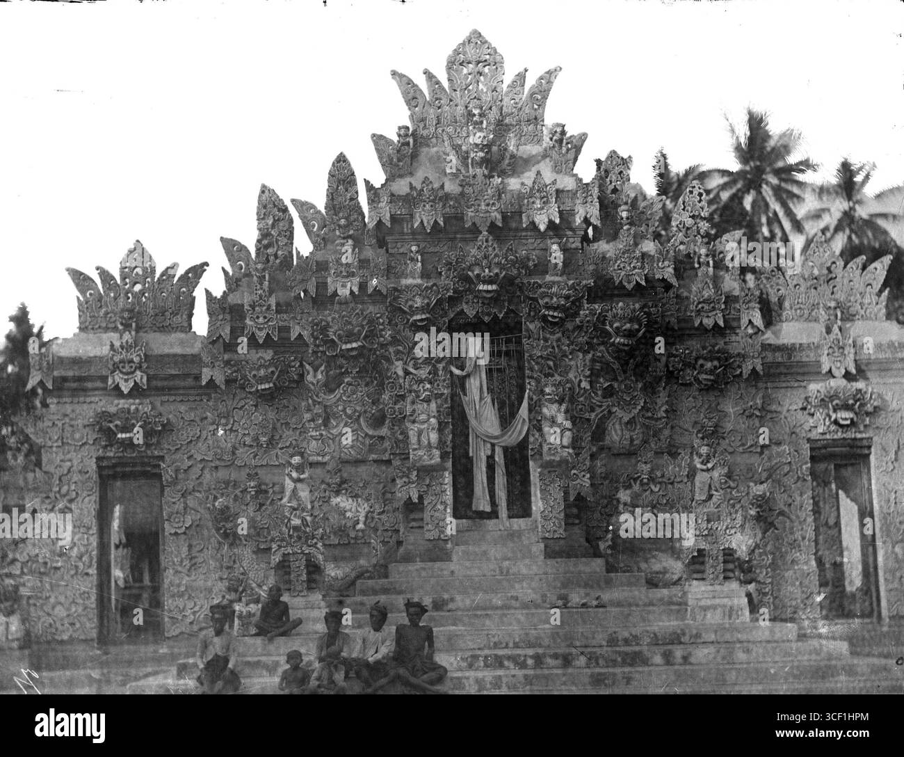 Between 1880 and 1910, Indonesians are pictured on the steps of the Pura Beji Temple in Sangsit ...
