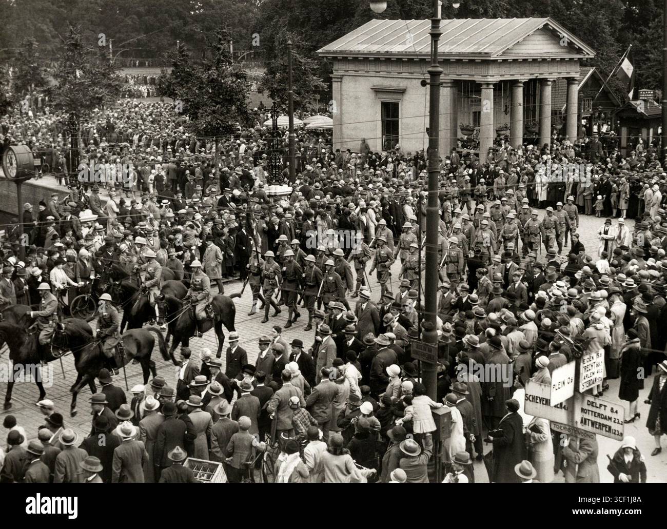 In 1929, a large crowd gathers to watch military parades in The Hague ...