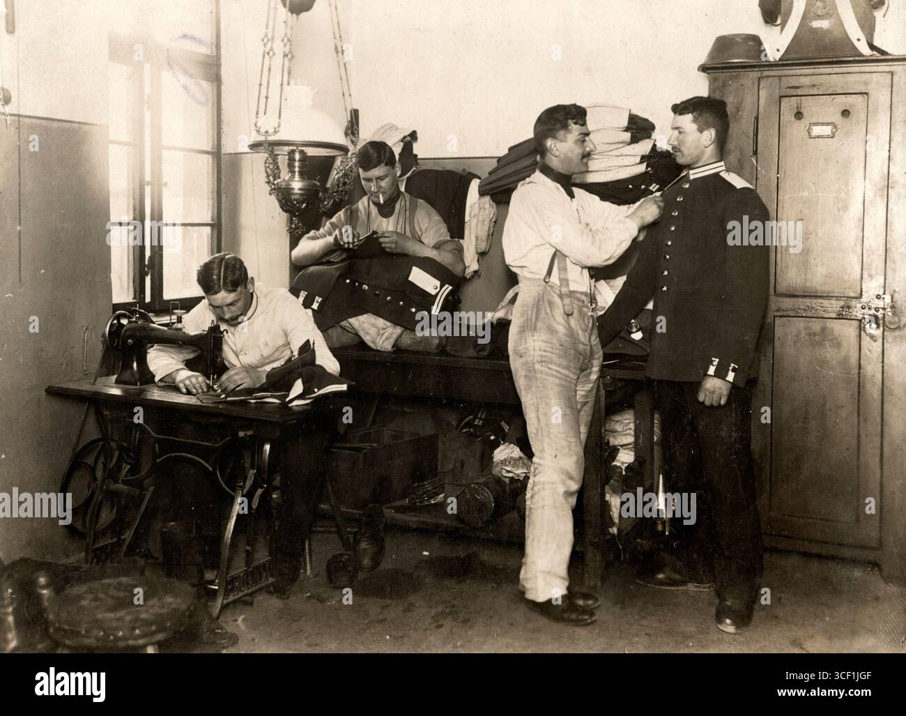 German army recruits are being drilled in 1913, with tailors adjusting ...