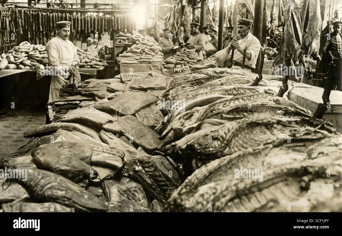 A view of a German butcher shop in 1916, showing beef carcasses and ...