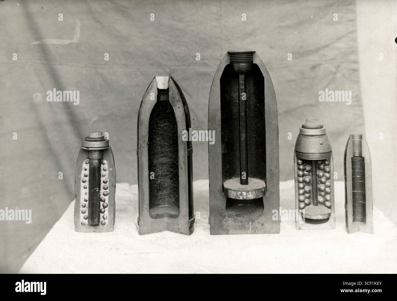 Cross-sections of five grenades from World War I, showing the internal ...