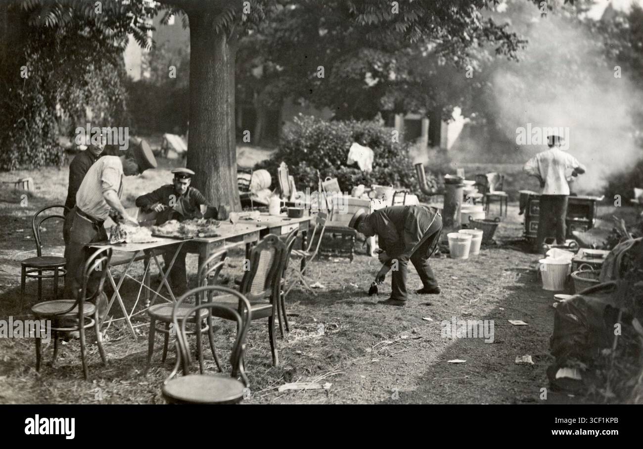 German soldiers are seen working in a field kitchen during World War I ...