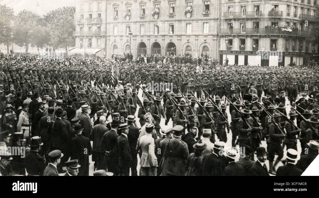 In 1917, American troops, including famous volunteer units, parade upon ...