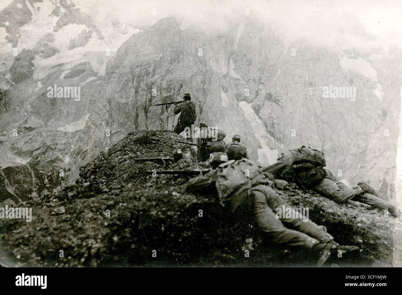 In 1915, soldiers are camouflaged on a mountain in the Alps, preparing ...