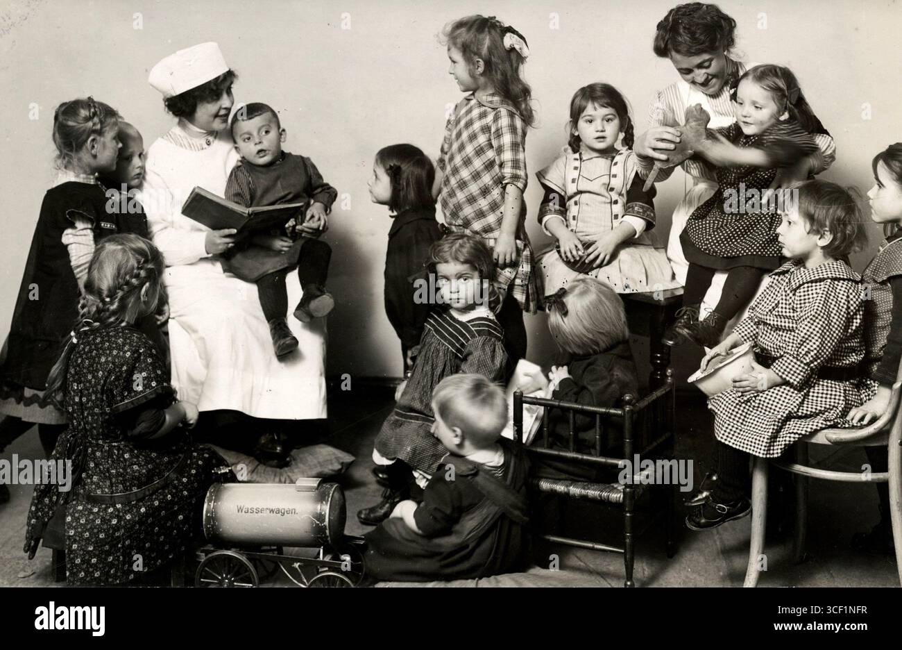 During World War I, reading to children at a shelter for German war ...