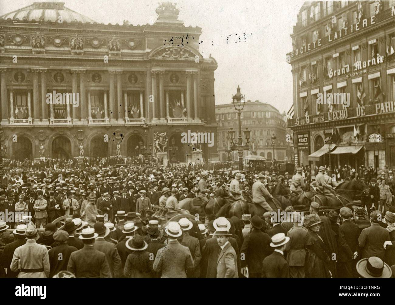 A crowd gathers at Place de l'Opéra in Paris to watch the military ...