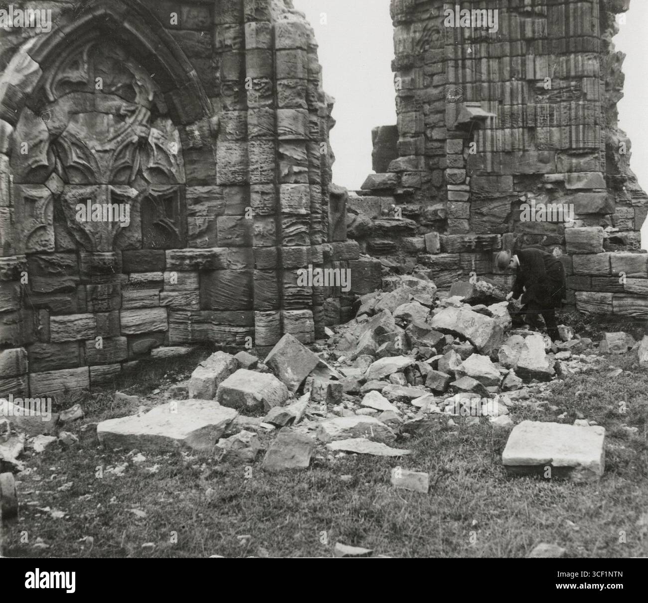 A man examines the rubble at the damaged ruins of Whitby Abbey, which ...