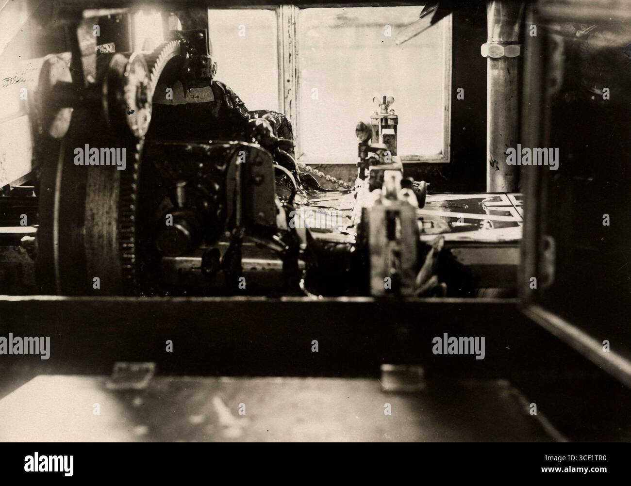 In a chocolate factory, a molding machine is used to cast chocolate ...