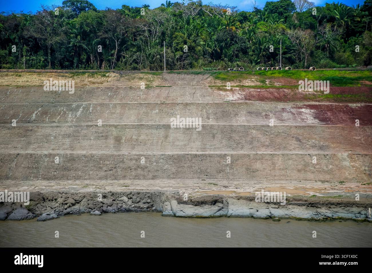 Exposed geological layers and terraced slopes along the Culebra Cut in ...
