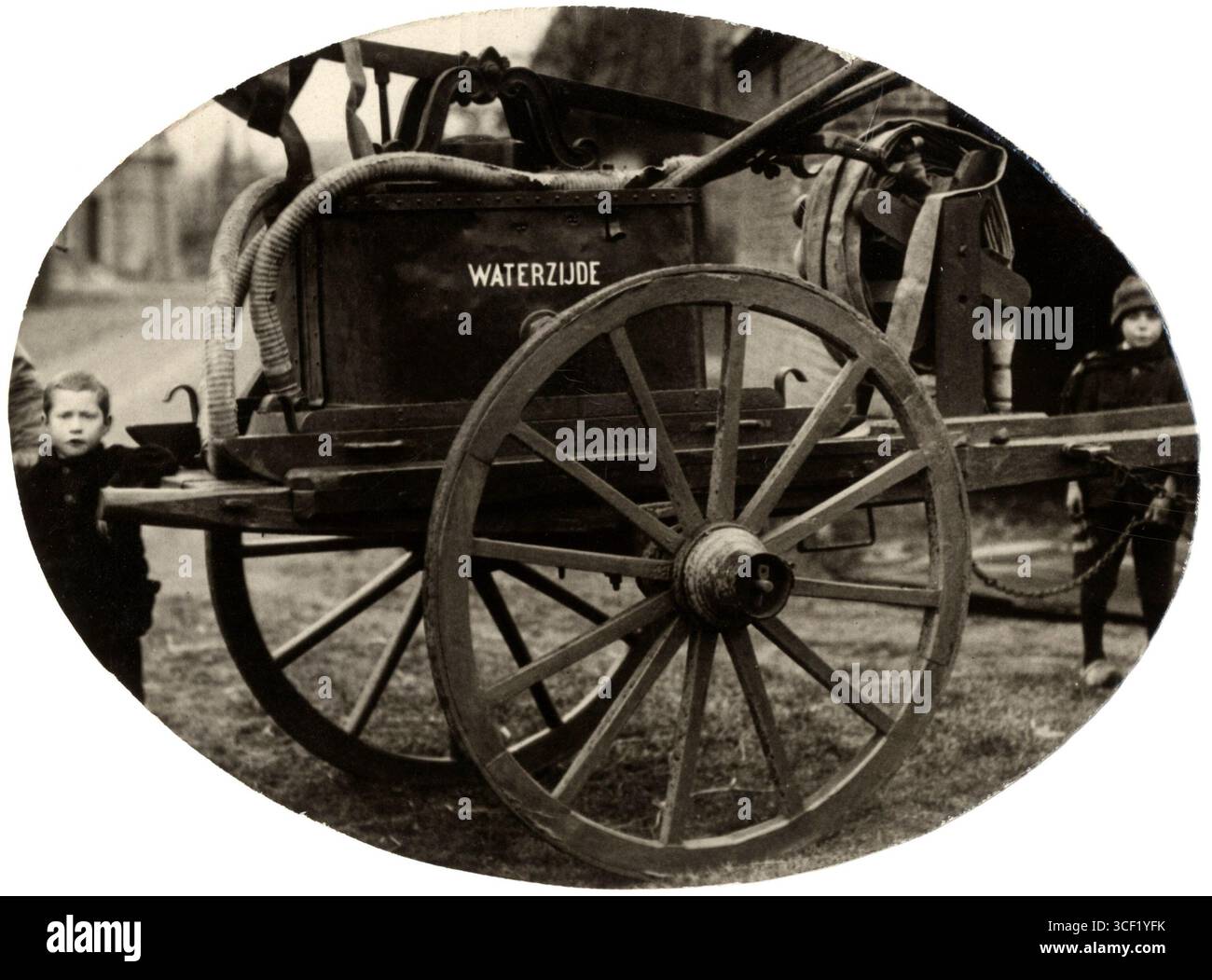 A 1924 photo shows a defective village fire engine in Leende, North Brabant. The malfunctioning ...