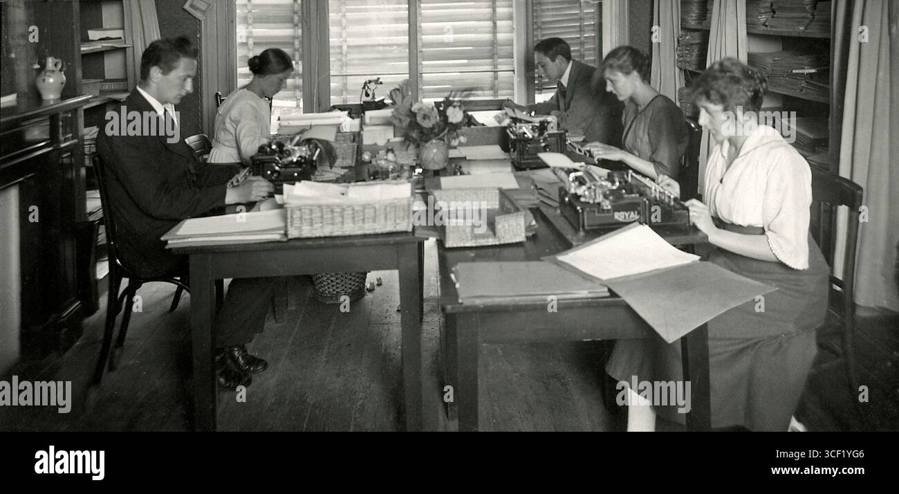 Staff members of the Amsterdam Rent Commission working in an office ...