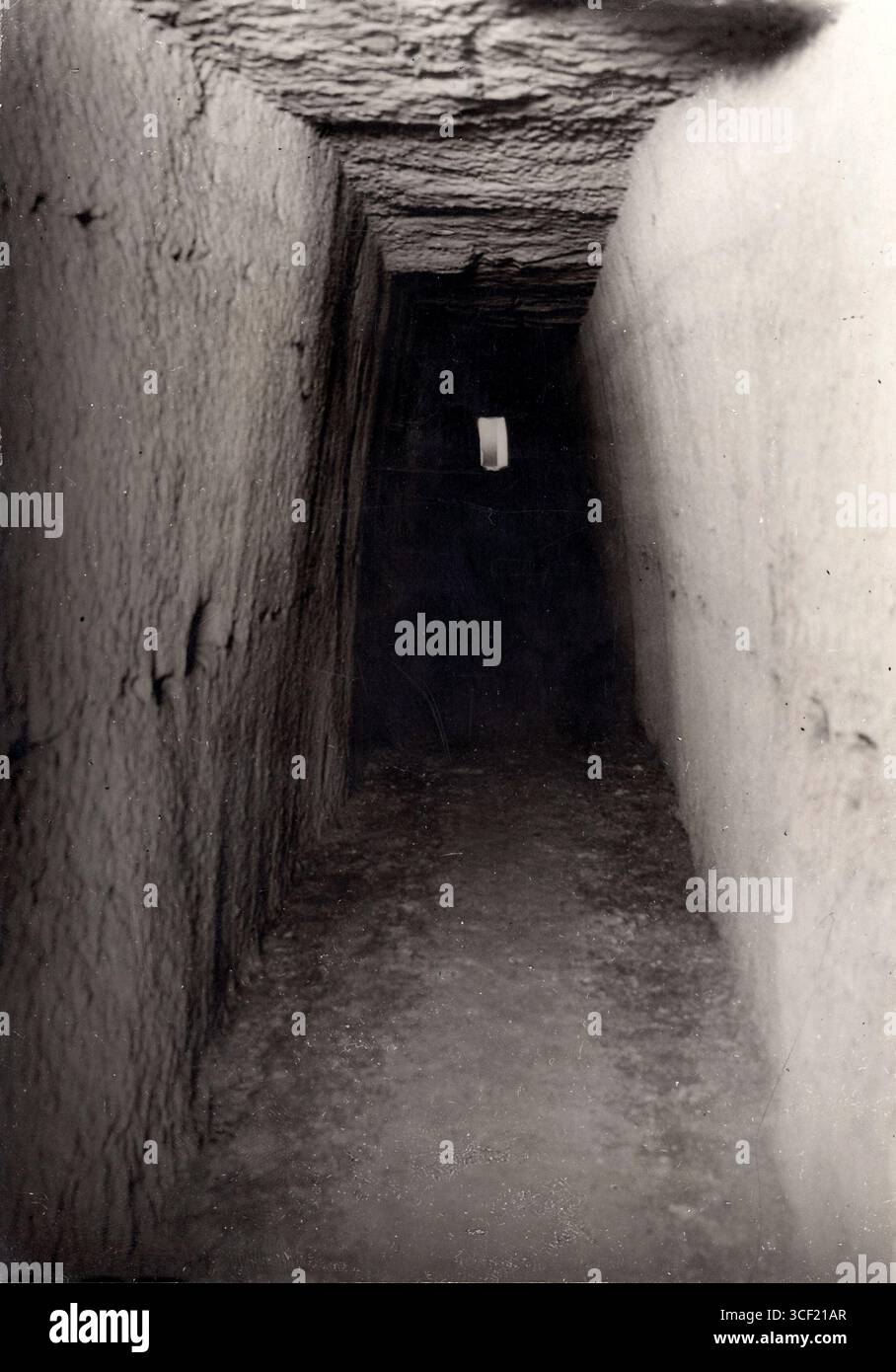 A corridor inside the Paris Catacombs in 1929. The catacombs are ...