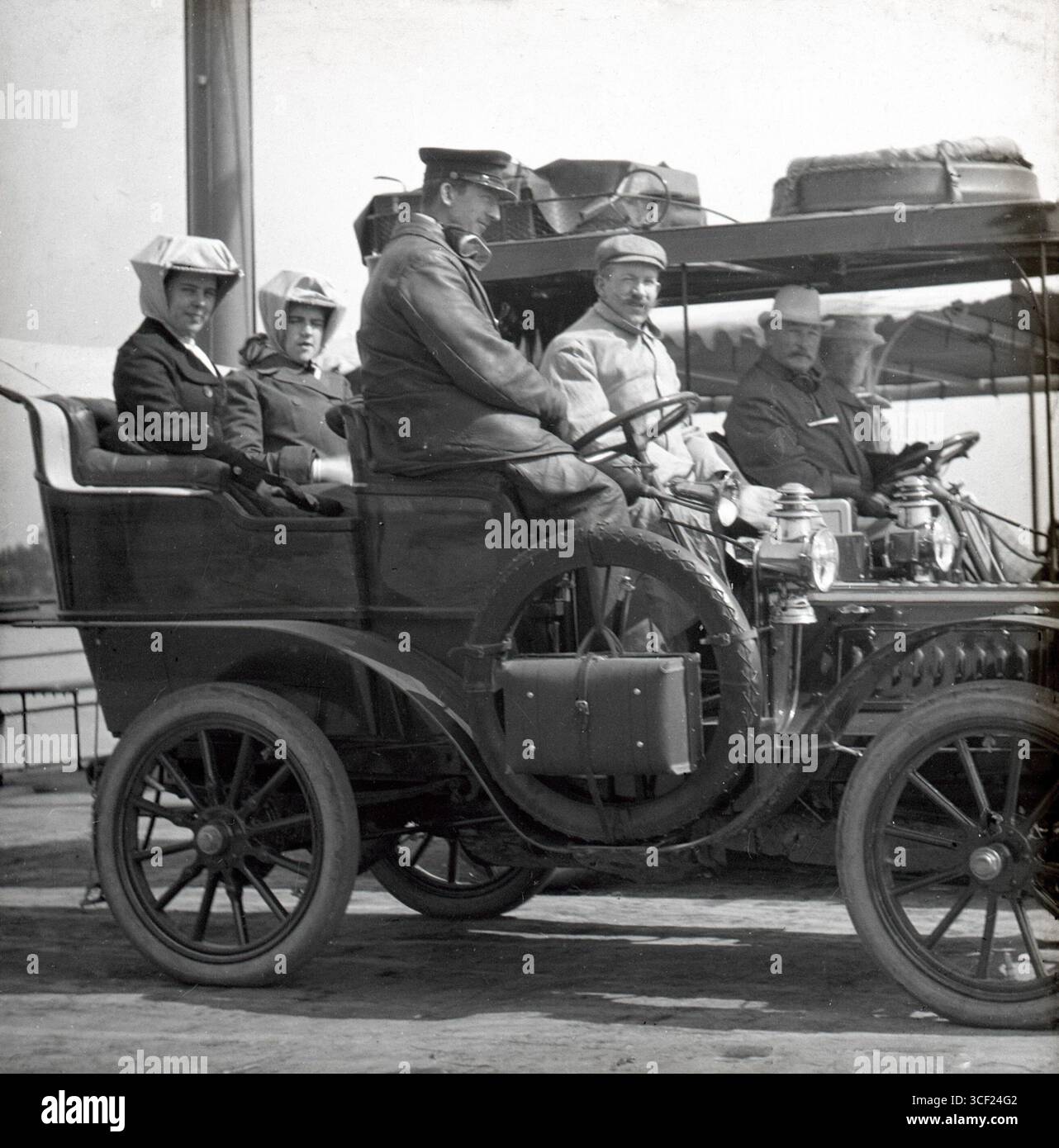 An early 20th-century automobile on a scenic tour around 1910 ...