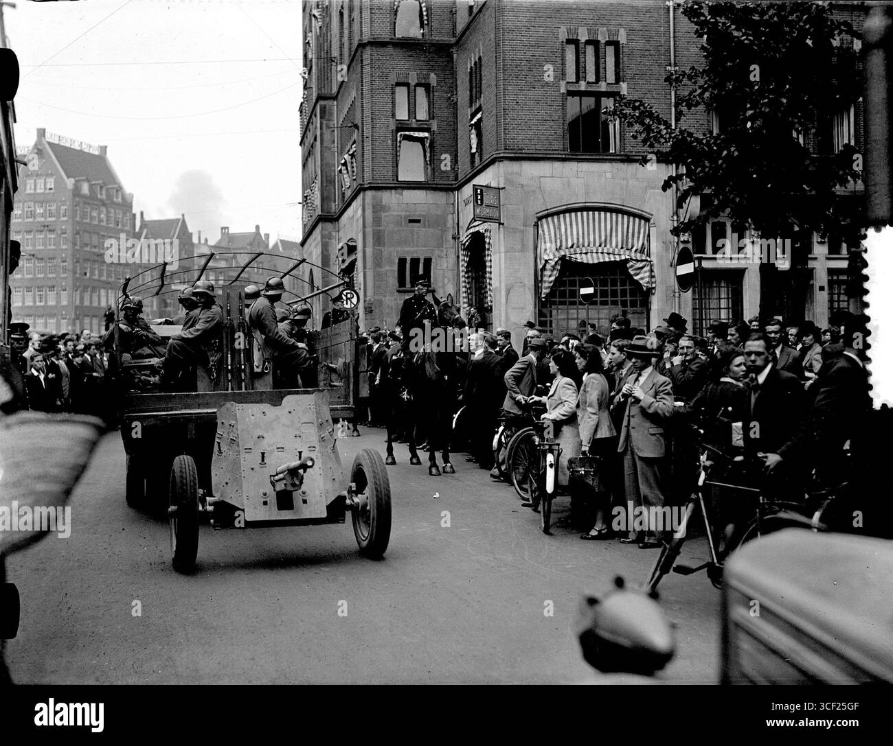 German troops entering Amsterdam are observed by shocked civilians at ...