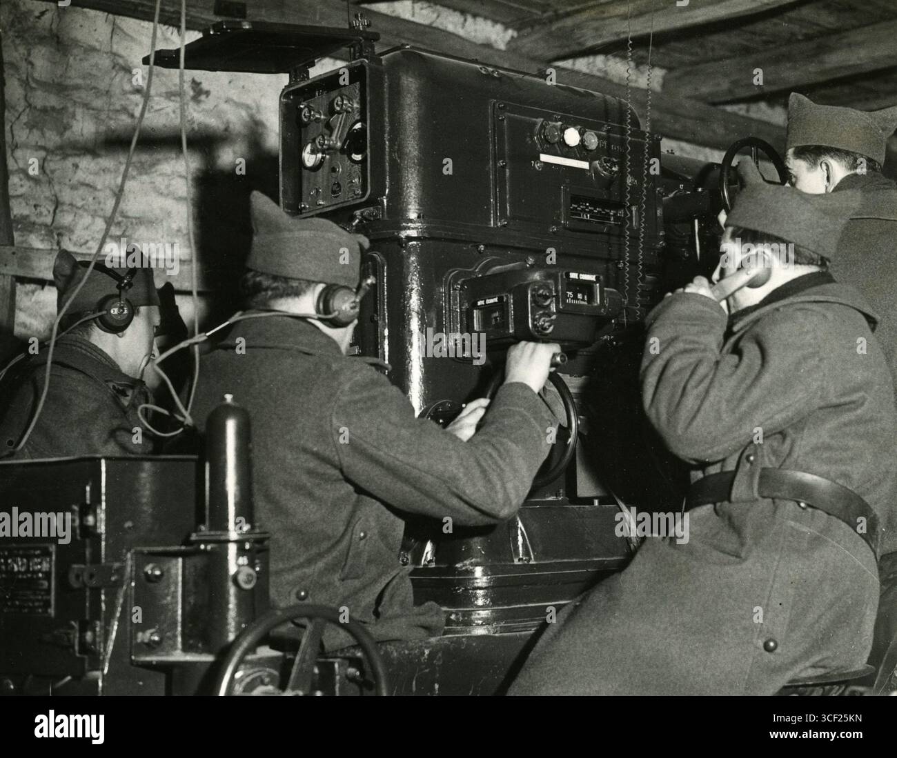 French soldiers use listening equipment to detect airplanes during the ...