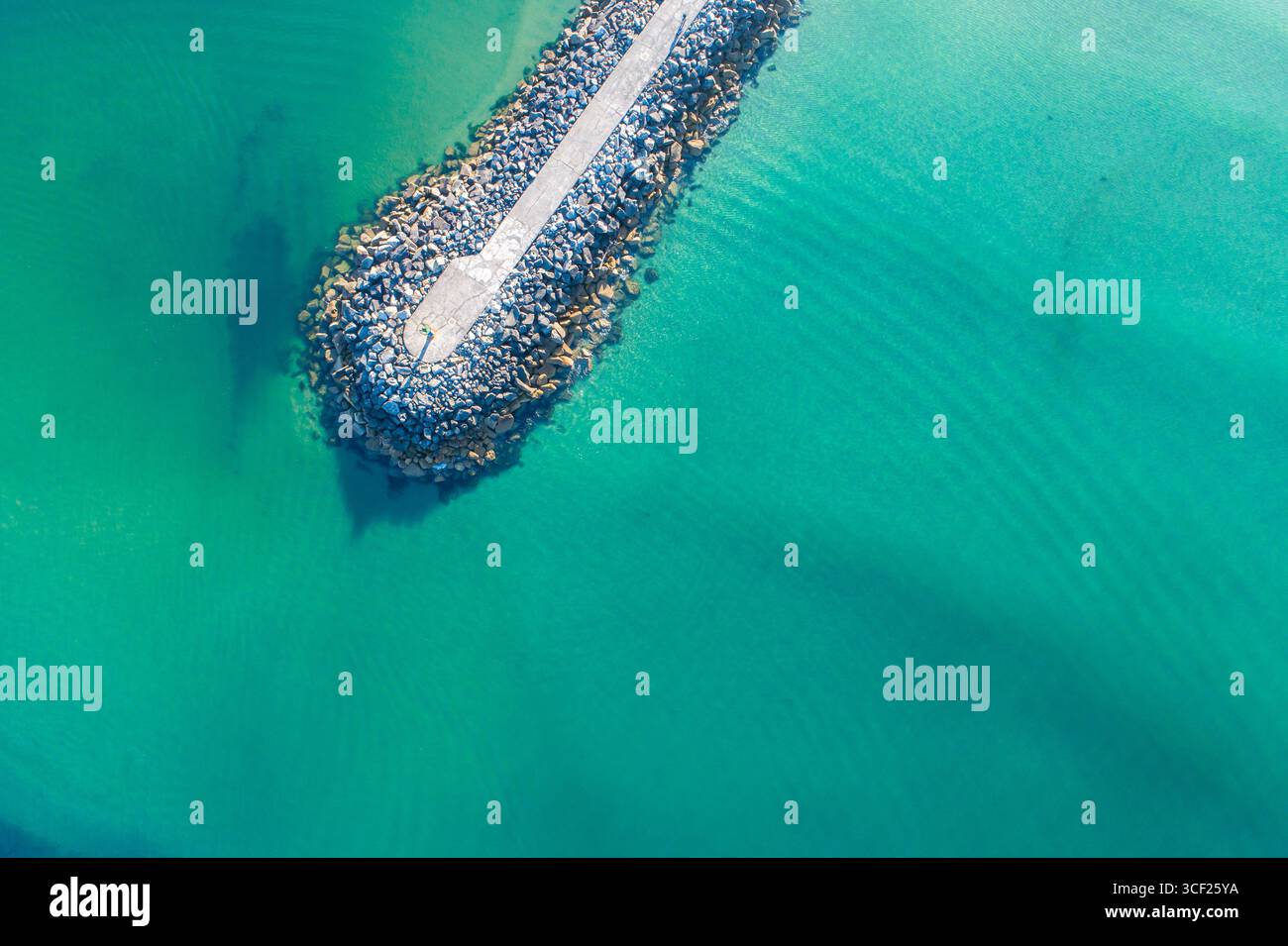 An Aerial View of a Breakwater with Ripples in the Sea. Concept The ...