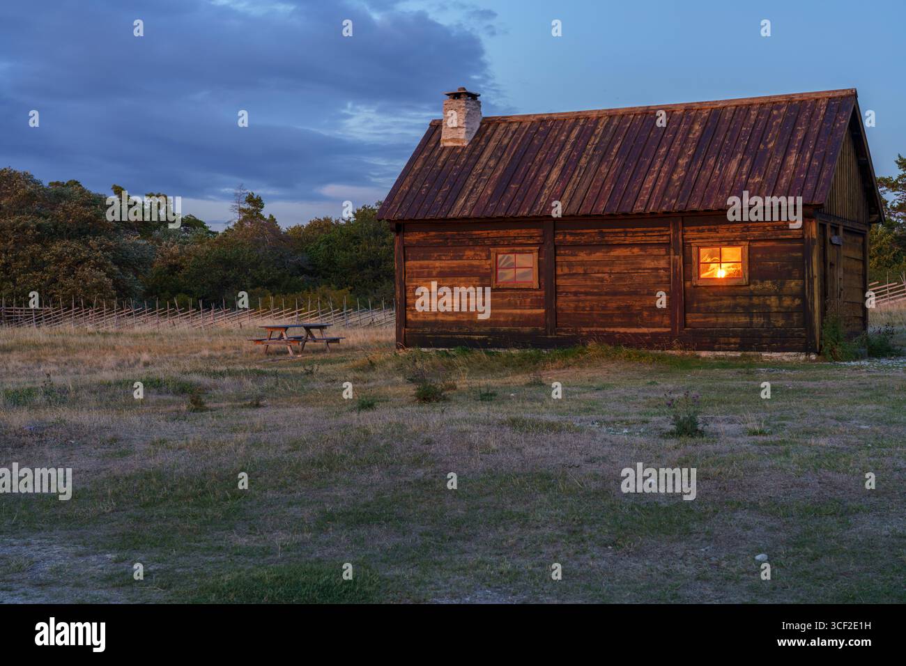 Kronvalds fishing camp on Gotland at sunset with sun reflecting in ...