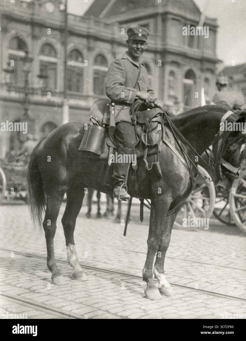 During World War I, a German orderly on horseback stands in front of ...