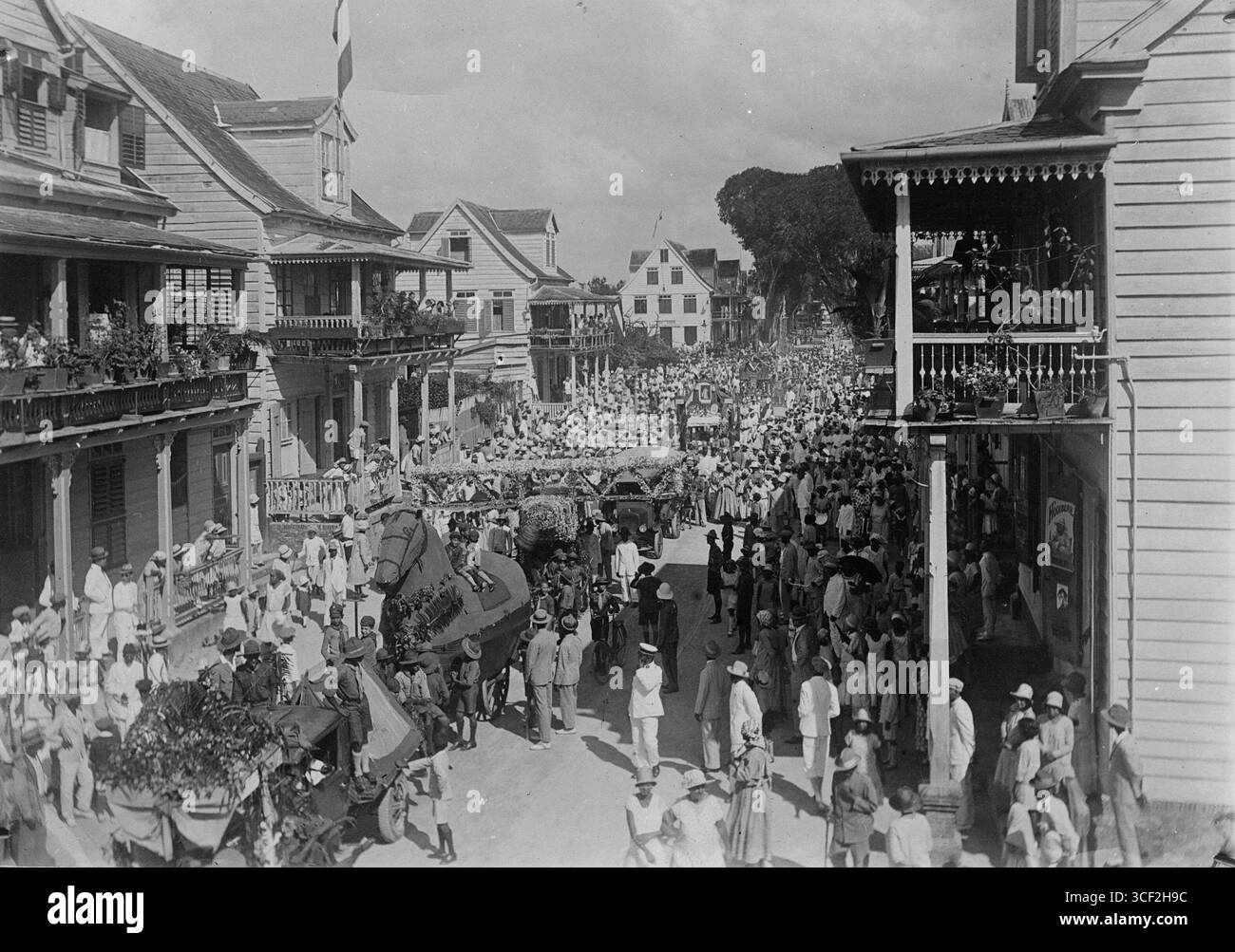 A reprint negative from 1930 showing floats in the streets of ...