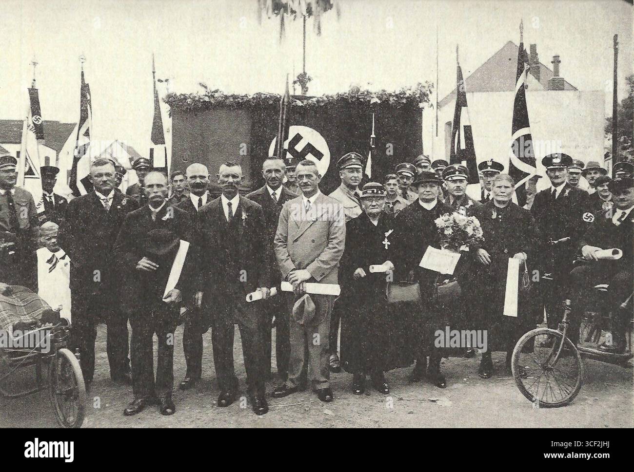 A 1935 event honoring agricultural workers in Ottersleben, Germany. The ...