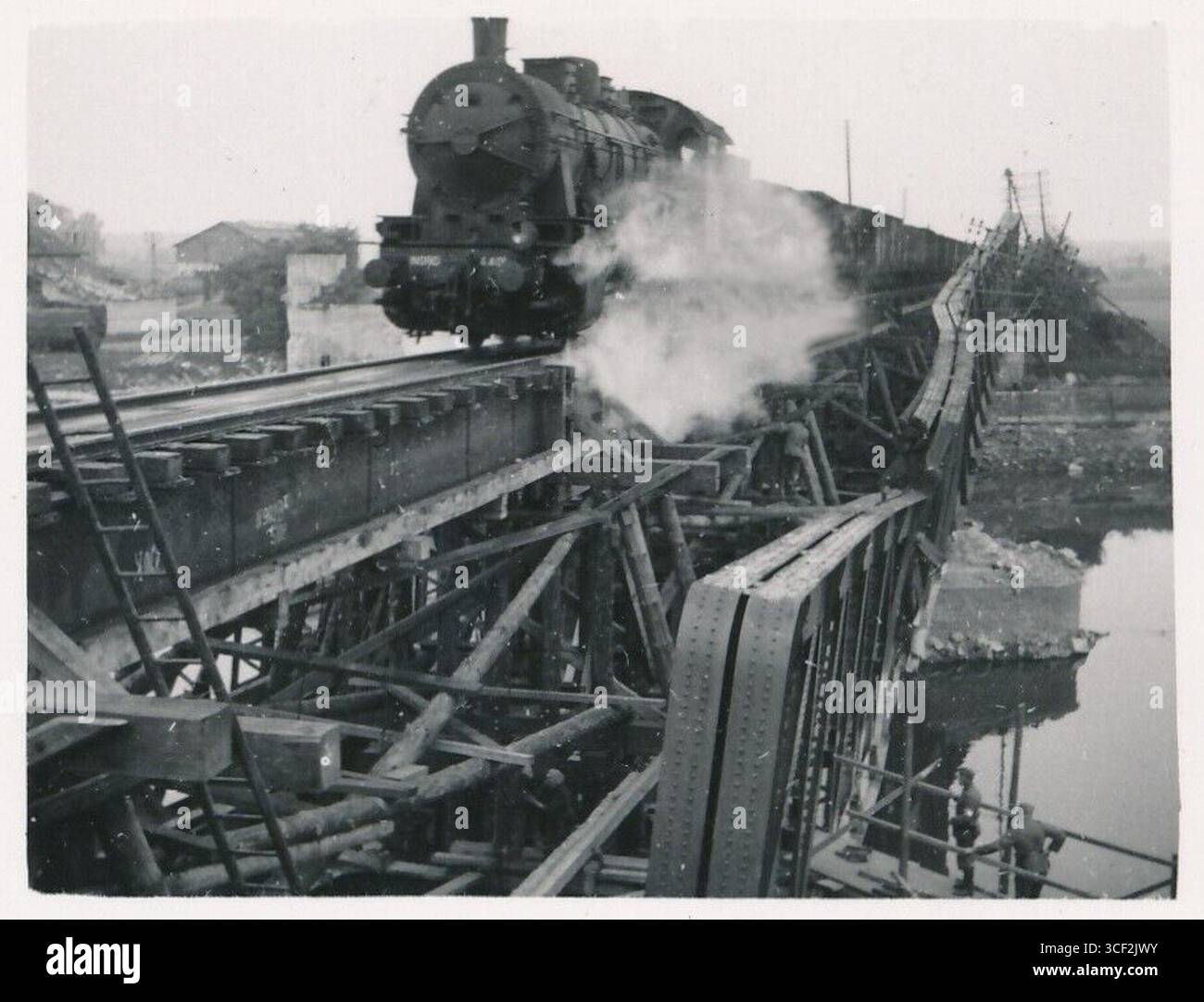 A temporary bridge over the Oise River, featuring a G8.1 locomotive ...