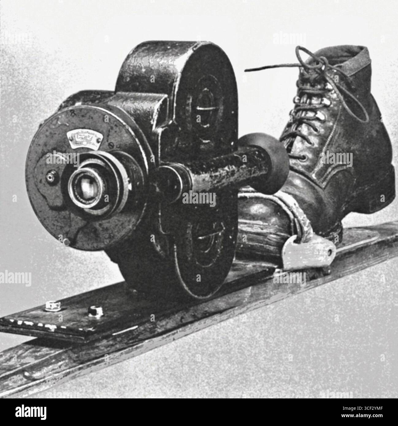 This photo shows an Eyemo 35mm film camera mounted on a ski, designed ...