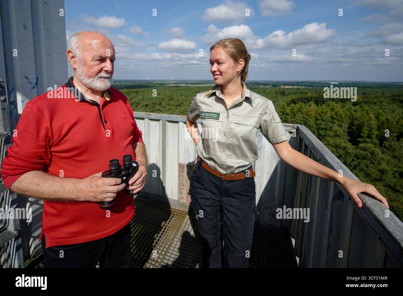 Dorsten, Germany. 20th Aug, 2025. Fire warden Rudolf Hoffmann (l) and ...