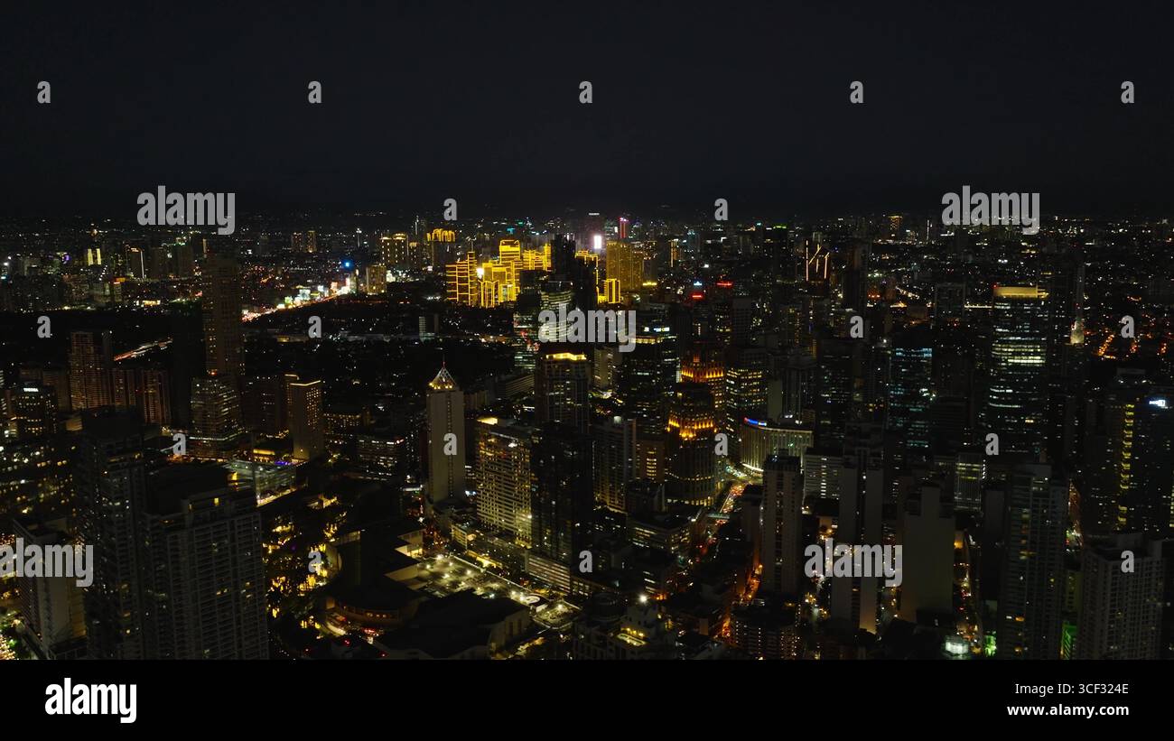 Manila with night skyline highlights its bustling streets, illuminated ...