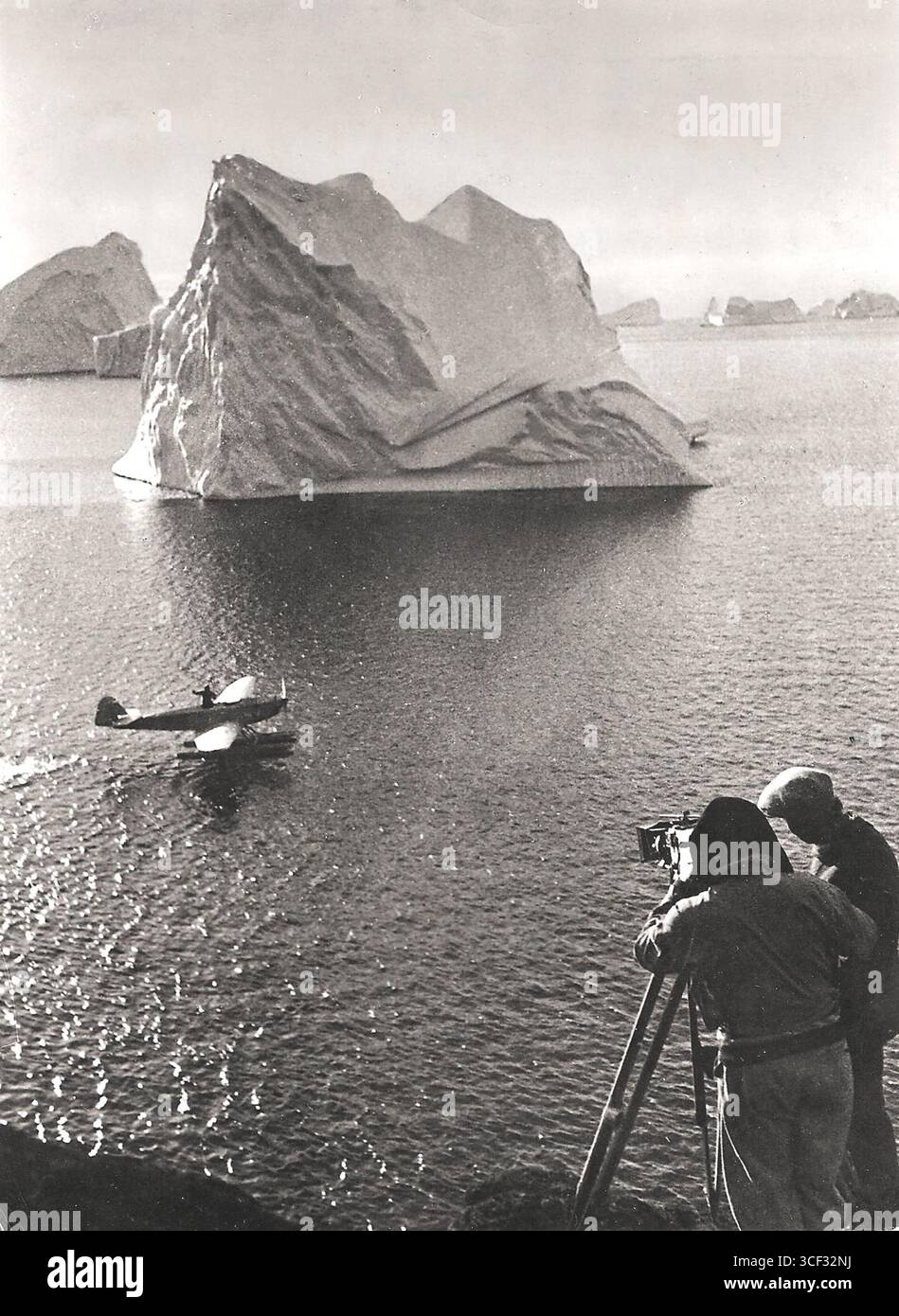 A still picture from *S.O.S. Iceberg* (1932) showing a plane and camera ...