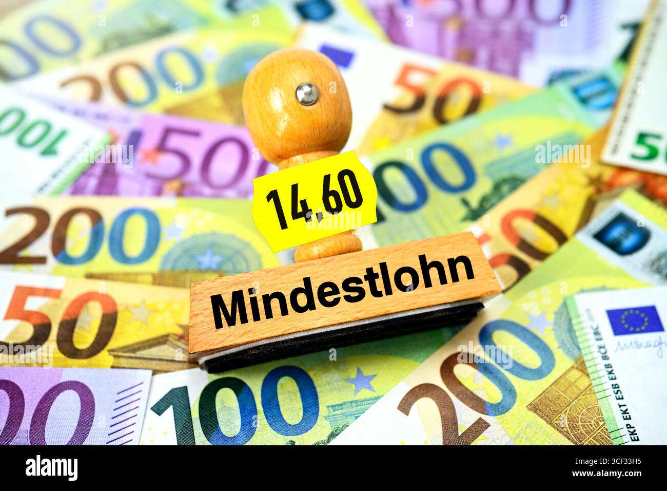 Stamp with inscription minimum wage on euro bills hi-res stock ...