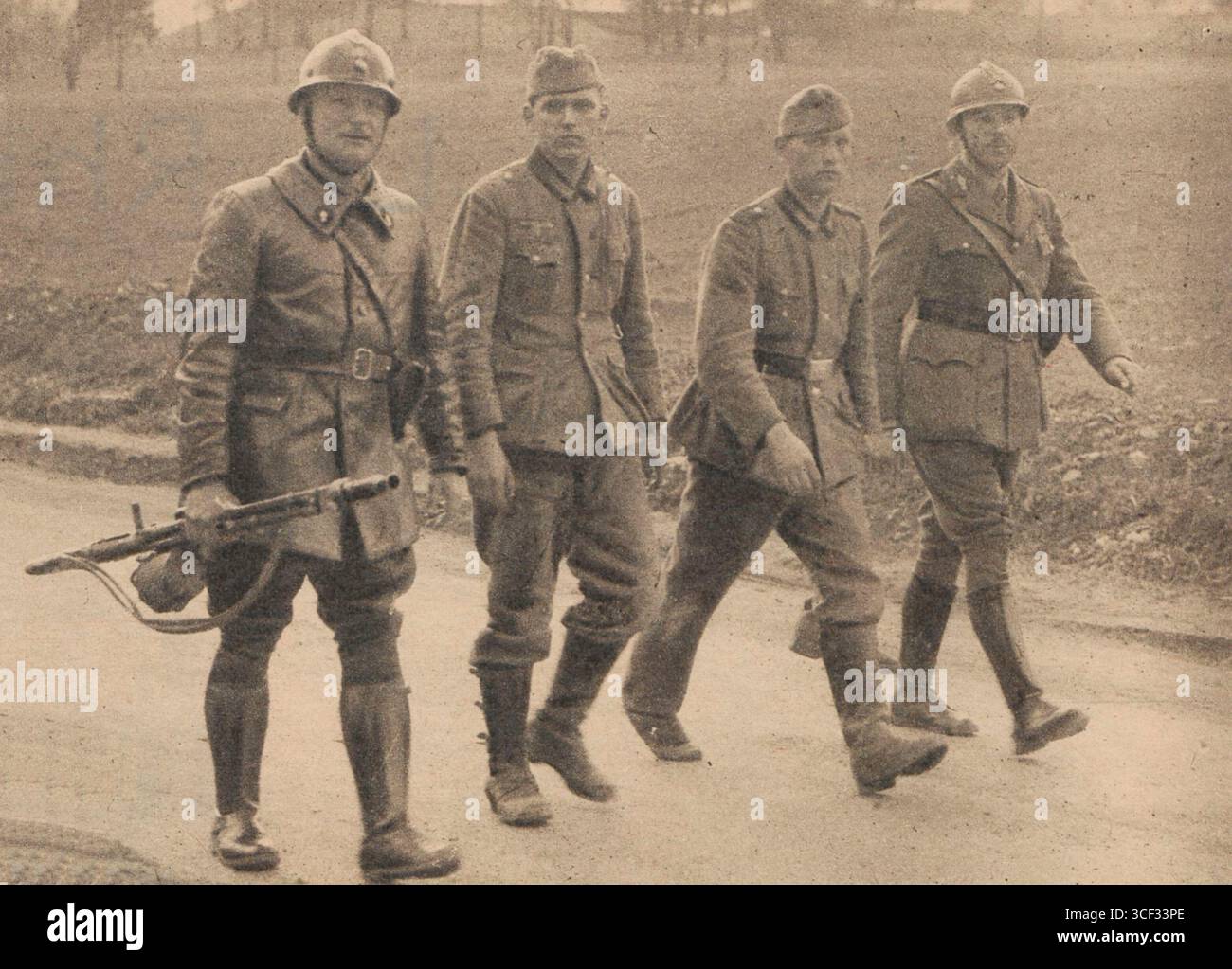 A photograph from April 1940 showing two German prisoners escorted by ...