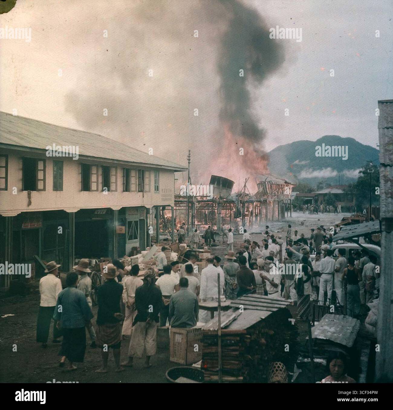 This dia from 1932-1940 shows another view of people watching a fire in ...