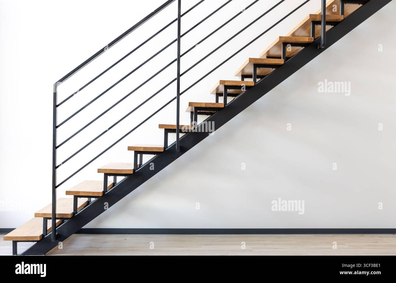 Modern loft staircase. Wooden steps and metal railings. Minimalist ...