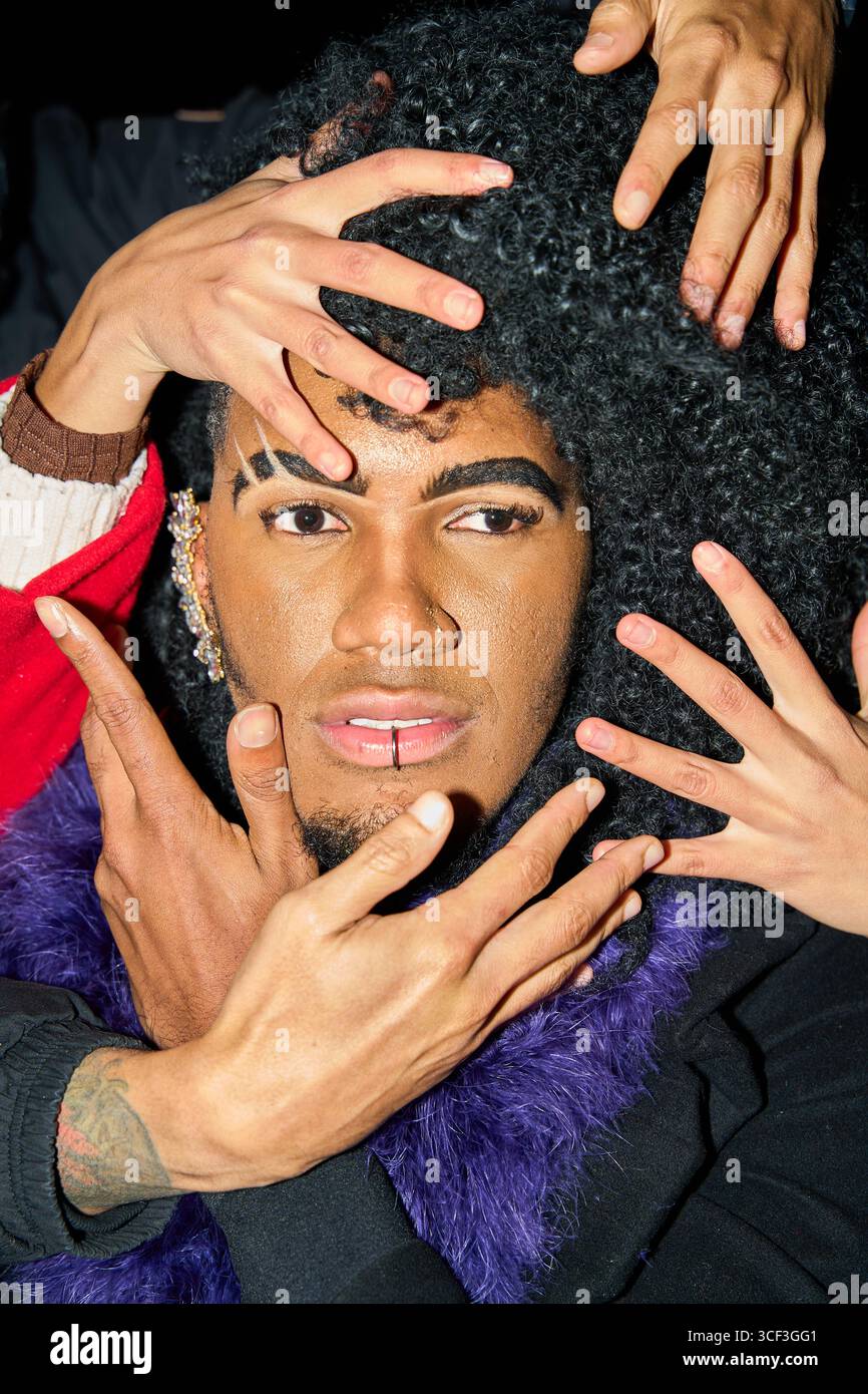 Many hands touching face hi-res stock photography and images - Alamy