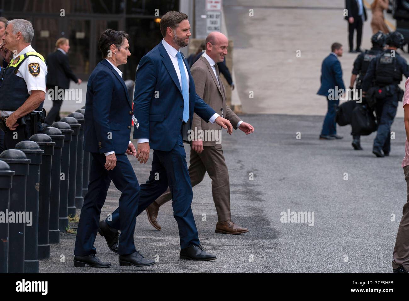 Vice President JD Vance, center, accompanied by White House Deputy ...
